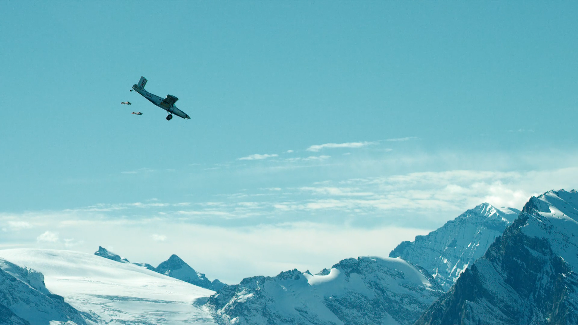 BASE Jumping INTO a plane mid-air. AMAZING! | skyxtreme.tv