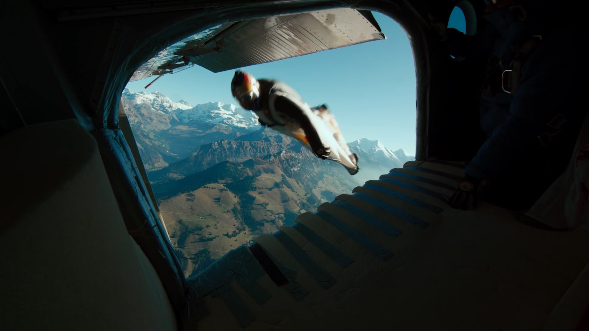 BASE Jumping INTO a plane mid-air. AMAZING! | skyxtreme.tv